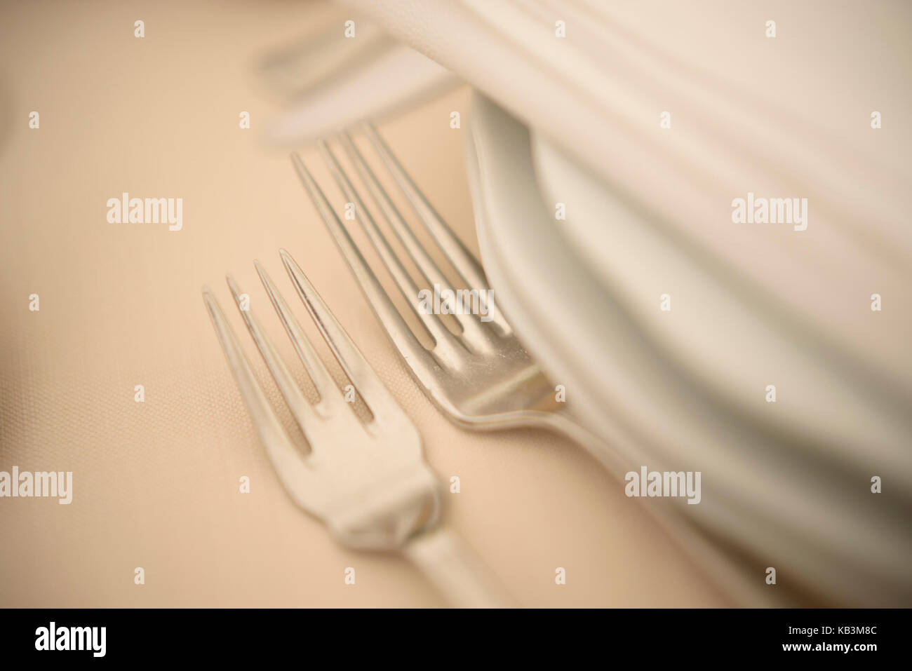 Plates and silverware on upscale restaurant table Stock Photo - Alamy