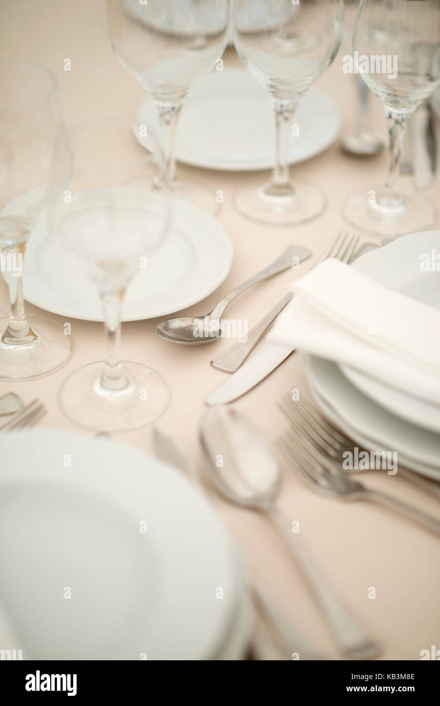 Plates and silverware on upscale restaurant table Stock Photo - Alamy
