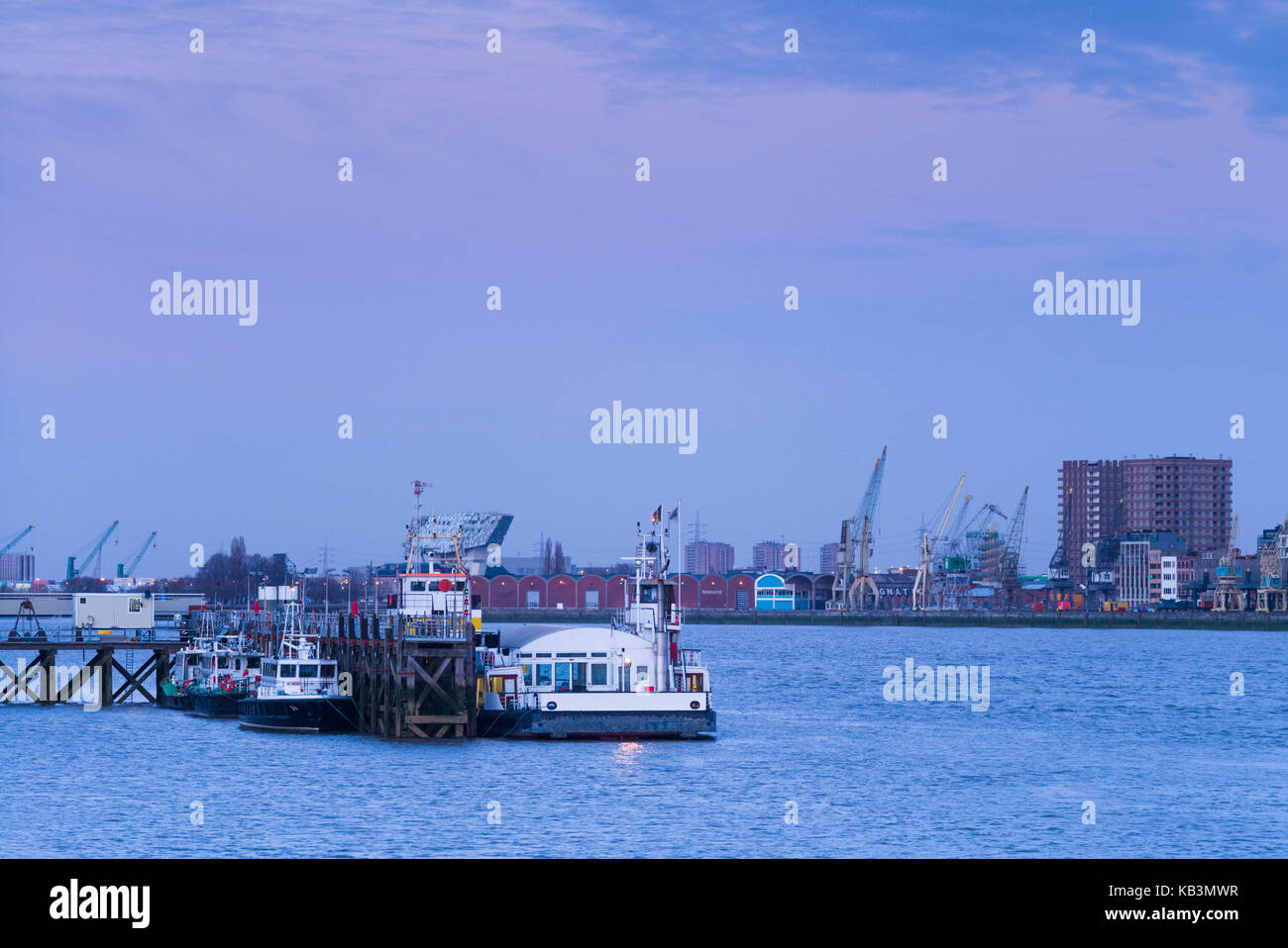 Belgium, Antwerp, city riverfront view from the Scheldt River, dusk ...