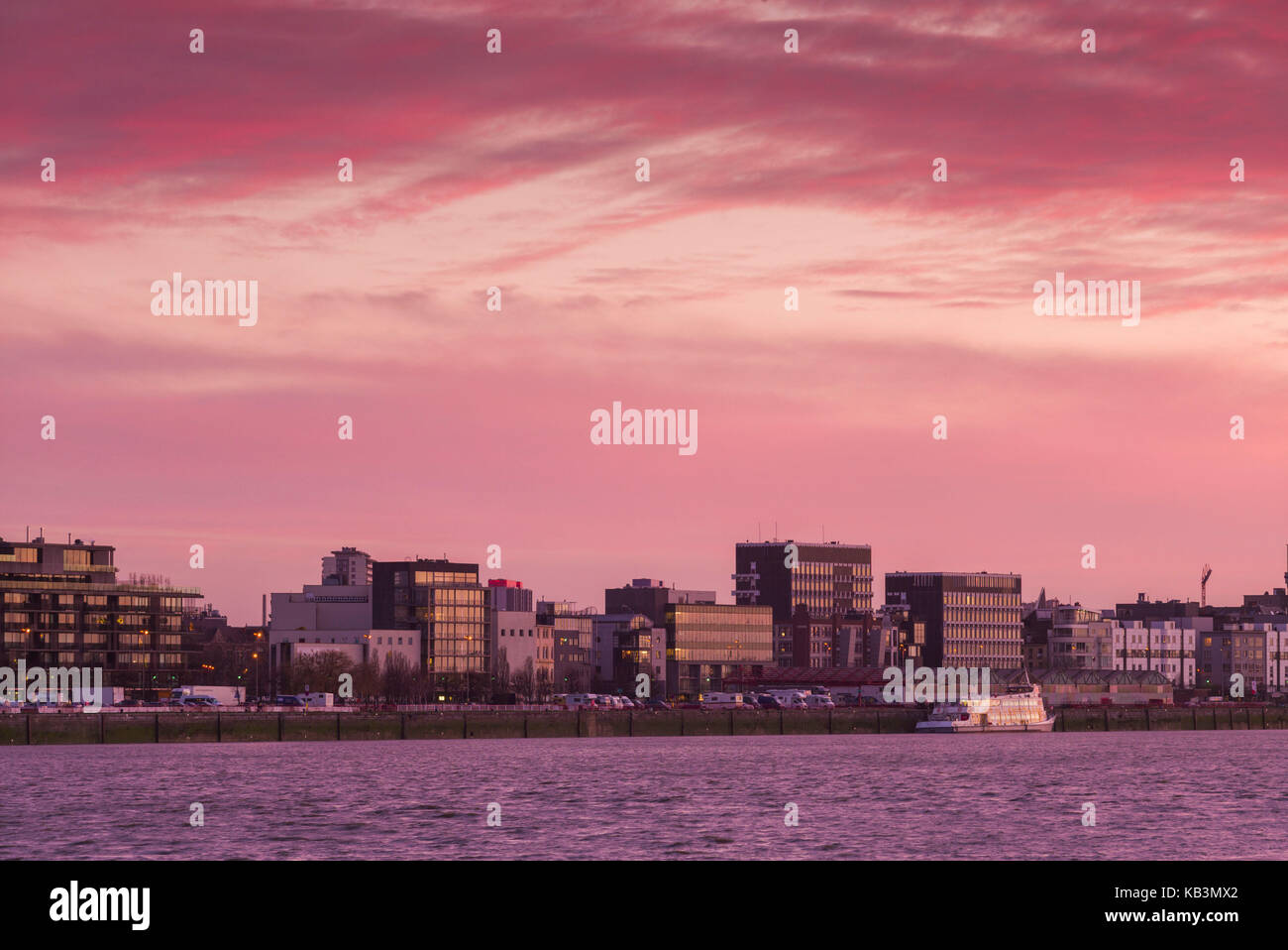 Belgium, Antwerp, city riverfront view from the Scheldt River, dusk ...