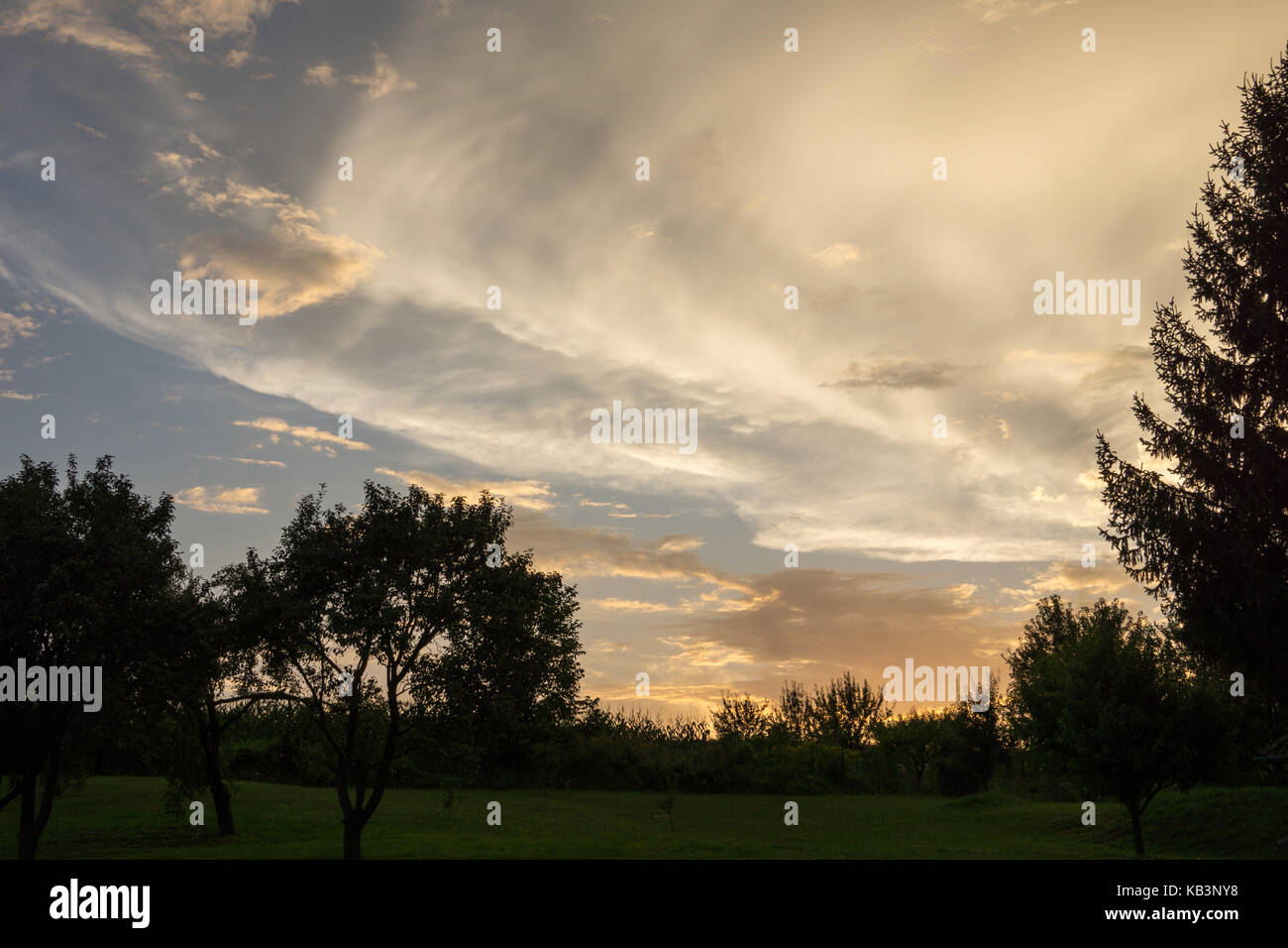 Sky at sunset with rain clouds Stock Photo - Alamy
