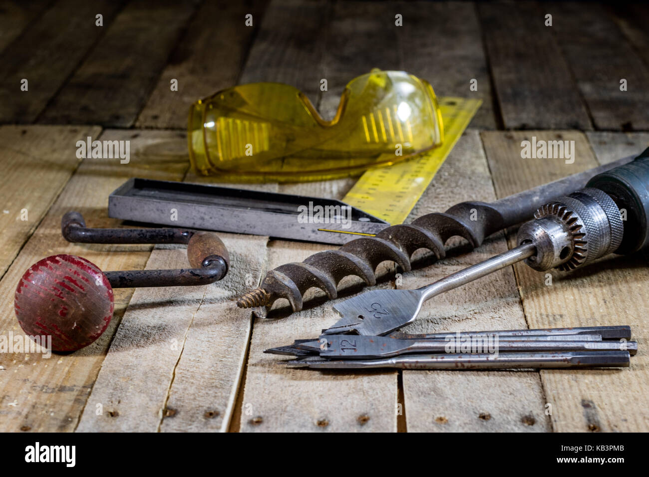 Old good carpentry, tools drill bit. Wooden carpentry table and old ...