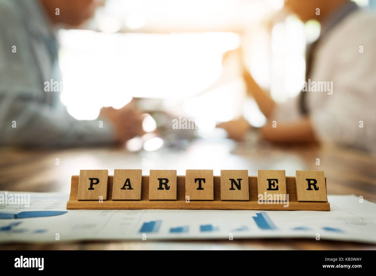 partner word on wood table with business man discuss for work during a ...