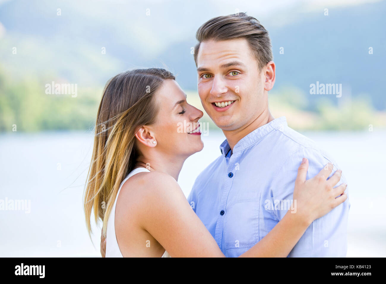 Picture of beautiful young couple cuddling and posing outdoor Stock ...