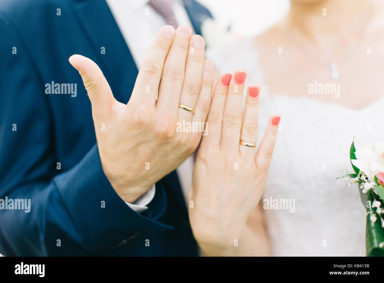Hands of bride and groom with rings. groom and bride are holding hands ...