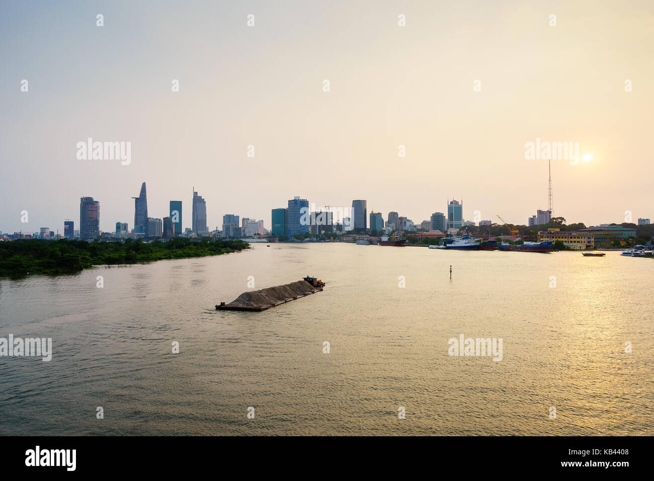Barge on Saigon river in sunset, Ho Chi Minh city, Vietnam. Ho Chi Minh ...