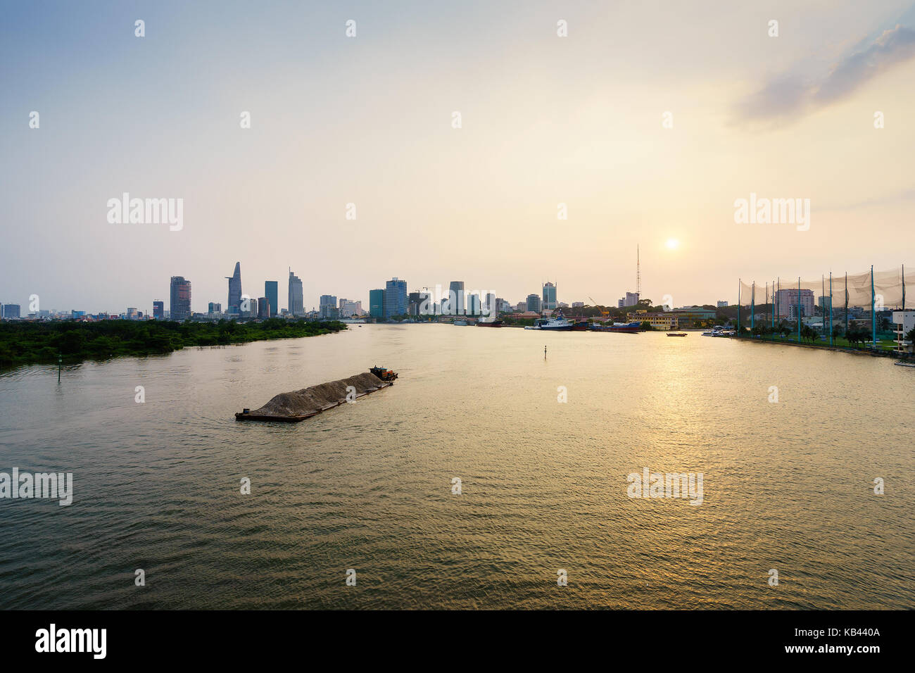 Barge on Saigon river in sunset, Ho Chi Minh city, Vietnam. Ho Chi Minh ...