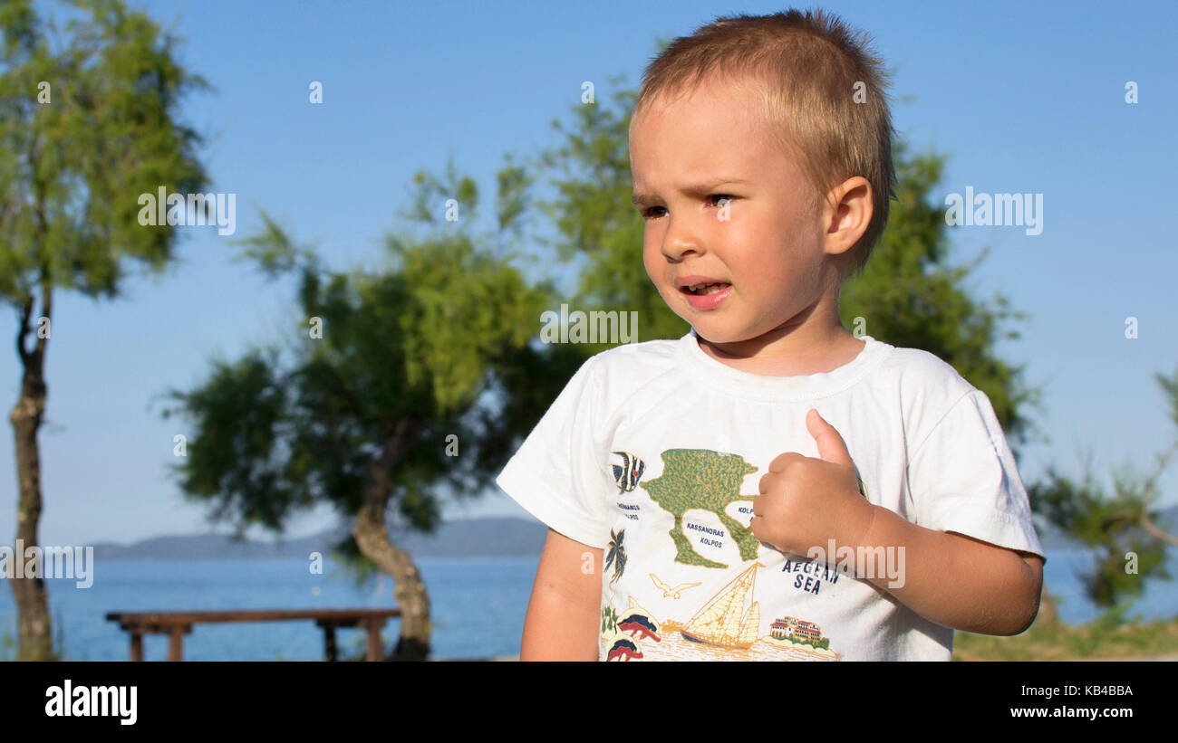 Cute little boy in park Stock Photo - Alamy