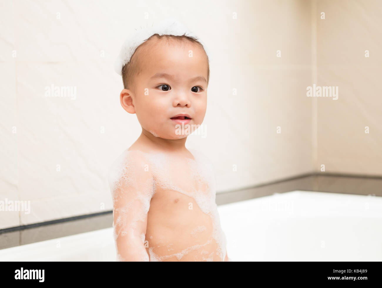 Boy standing in tub hi-res stock photography and images - Alamy