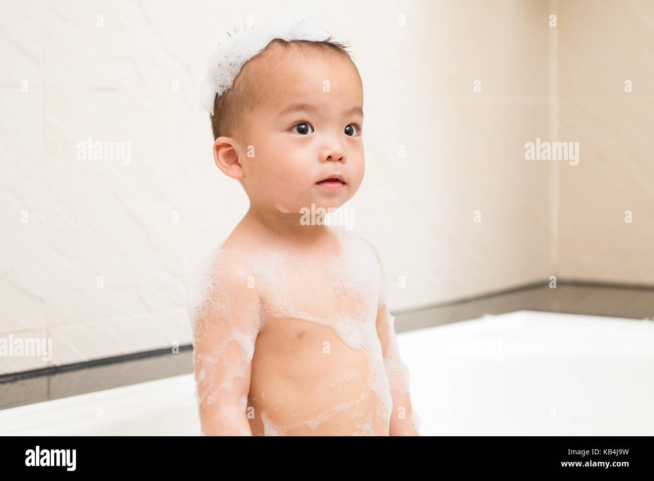 Boy standing in tub hi-res stock photography and images - Alamy