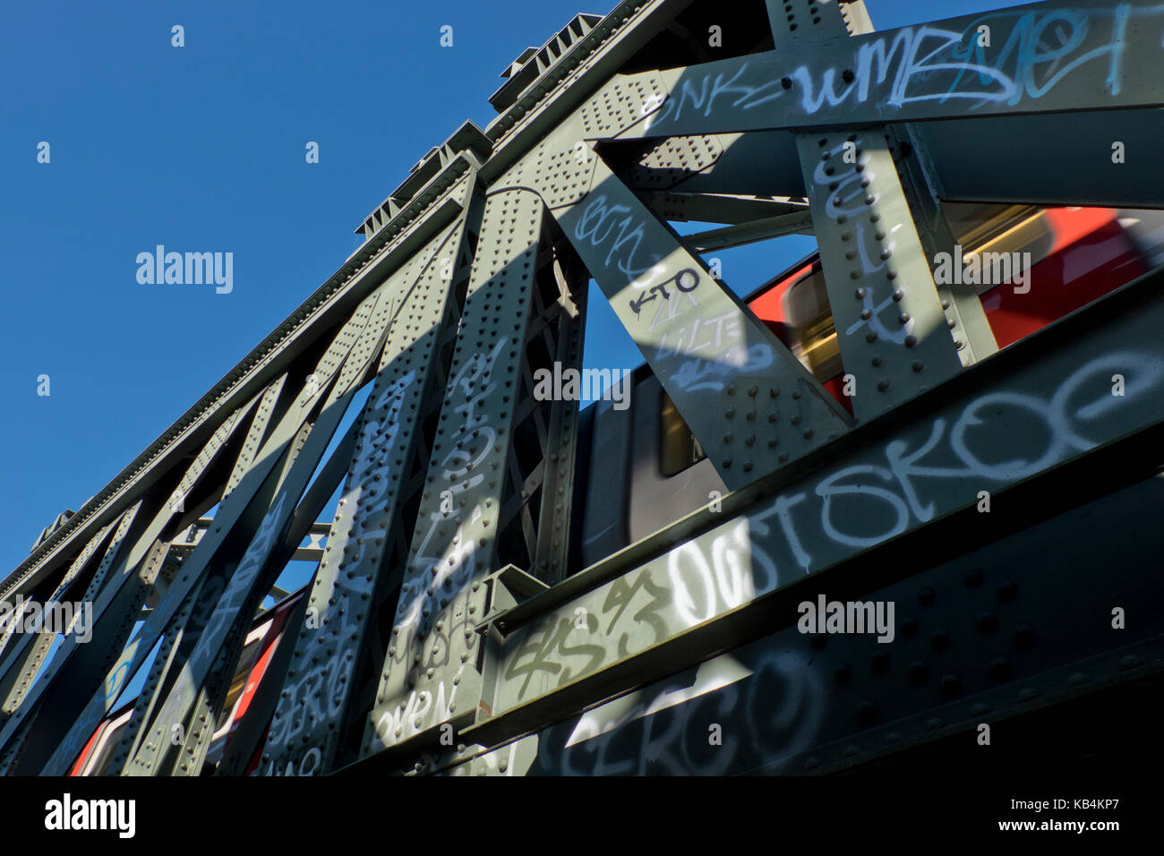 Train at high speed on a bridge with graffiti in Bow, London,UK Stock ...