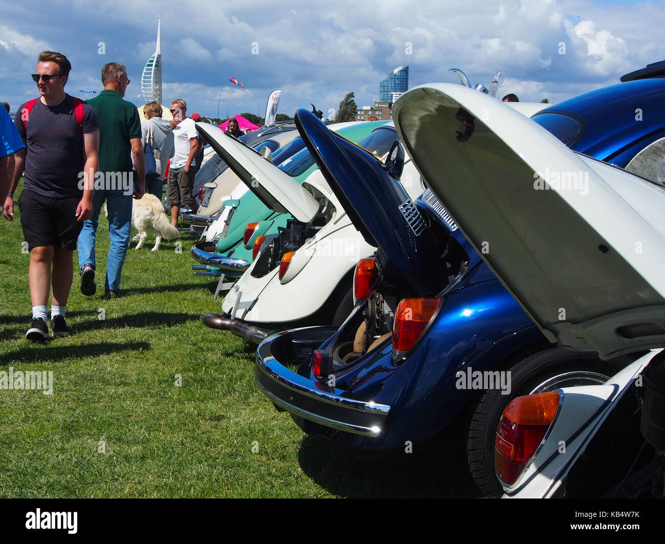 A row of VW beetles with their boots open displaying their engines ...