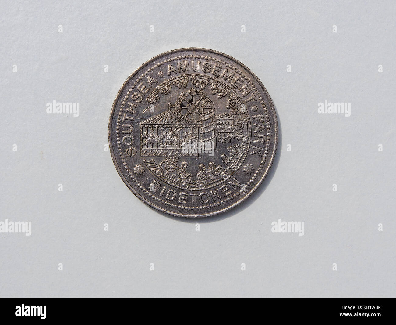 An old southsea Amusement park ride token Stock Photo - Alamy