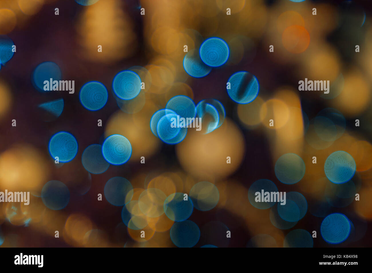 Blue and yellow lights as holiday background Stock Photo - Alamy