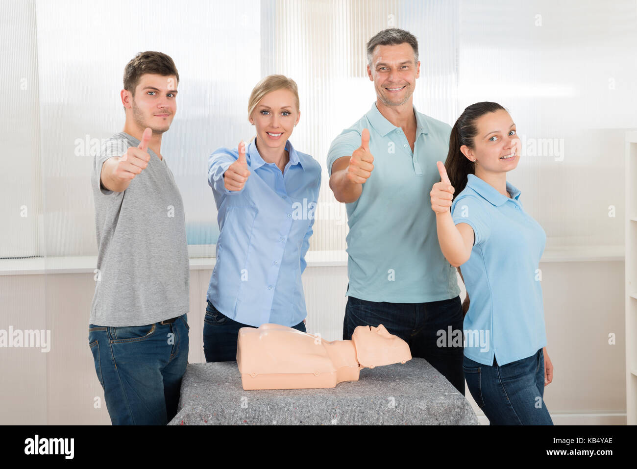 Group Of People Showing Thumbs Up Sign While Learning Resuscitation ...