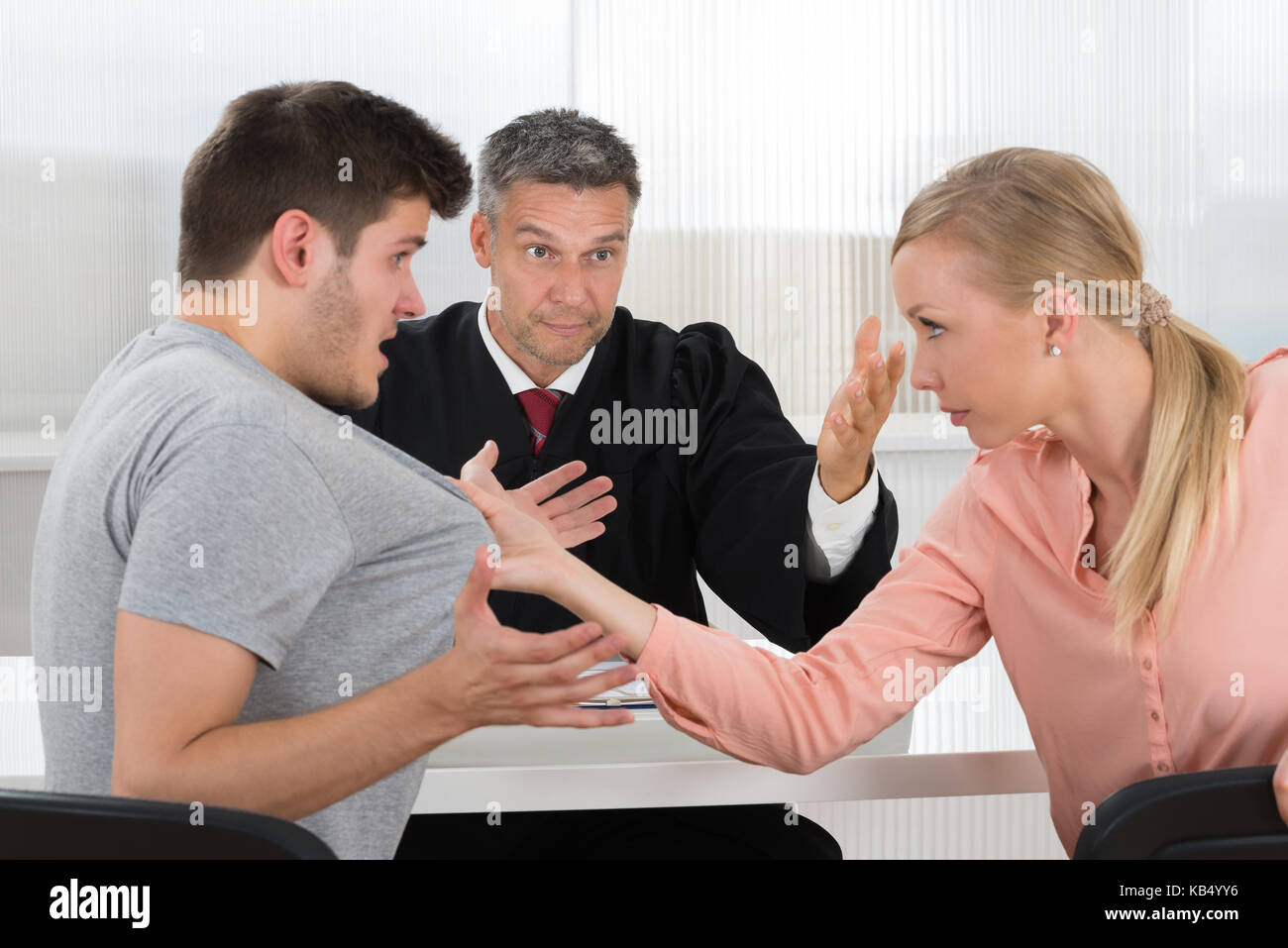Young Couple Fighting In Front Of Judge In Courtroom Stock Photo - Alamy