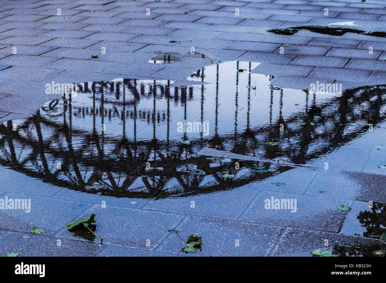 Upside Down Reflection in Puddle of Rainwater on the Quayside Newcastle ...