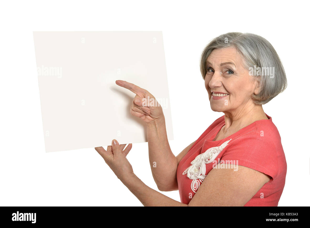 elderly woman pointing to blank card Stock Photo - Alamy