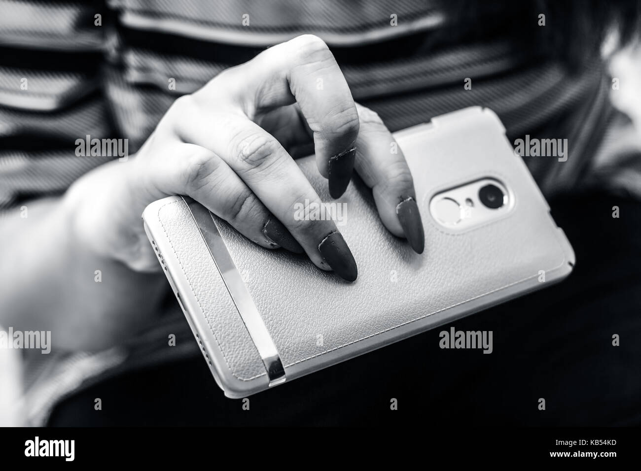 A female hand holding a smart phone different position Stock Photo - Alamy