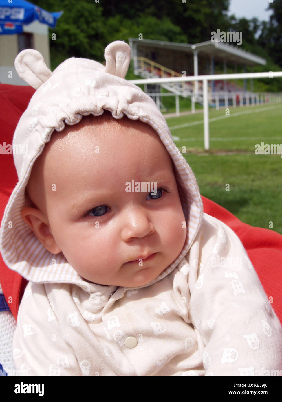 Portrait of little baby in the hood with ears Stock Photo - Alamy