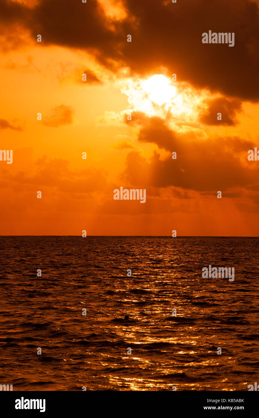 Sunset on the coast of the Caribbean Sea. Dominican sunset Stock Photo ...