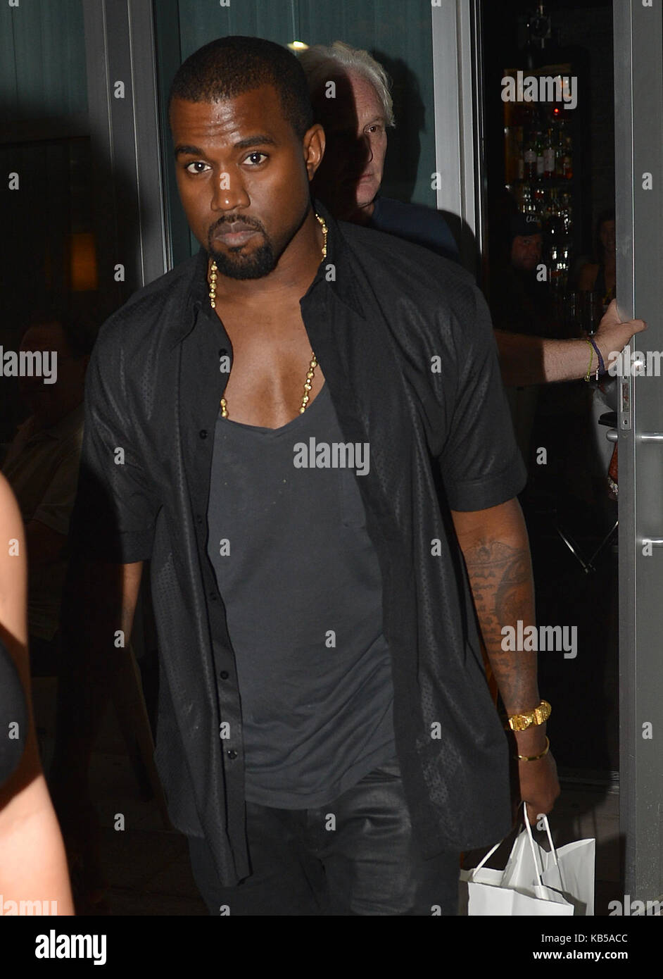 MIAMI BEACH, FL - OCTOBER 14: Kim Kardashian and boyfriend Kanye West ...