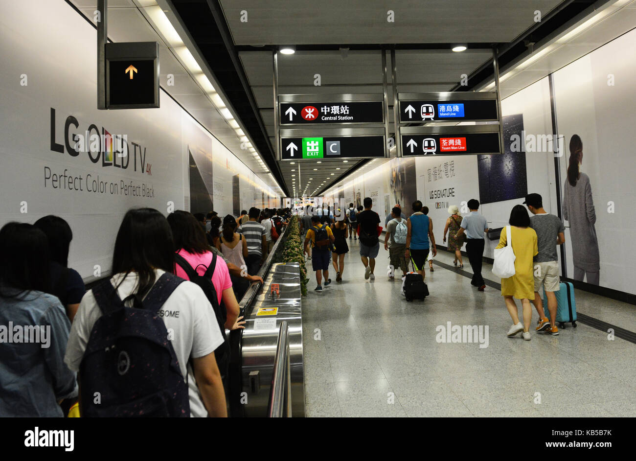 Passengers walking in the underground passage between Hong Kong station ...