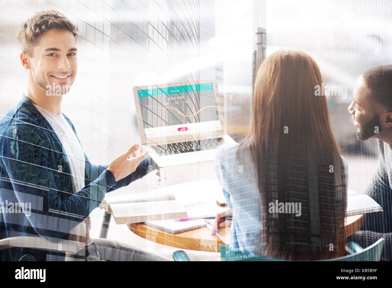 Pleasant man presenting his work to colleagues Stock Photo - Alamy