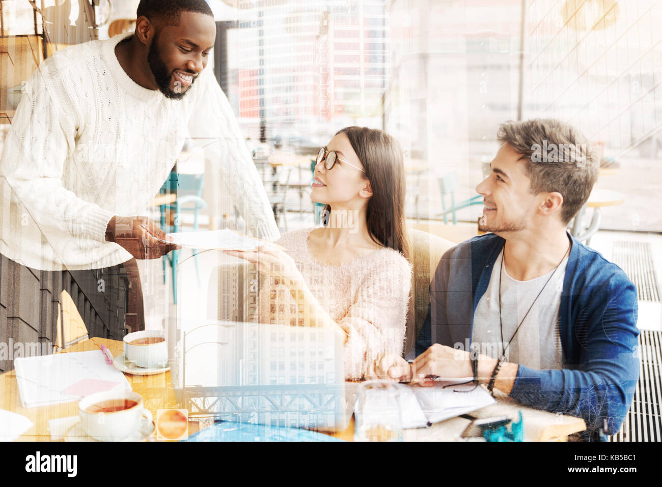 Intelligent colleagues working in informal atmosphere Stock Photo - Alamy