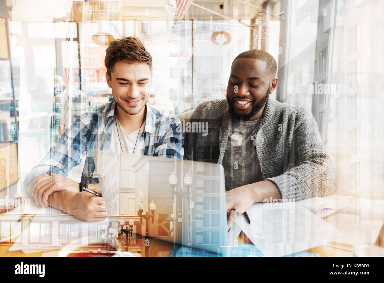 Optimistic colleagues busy with the new startup Stock Photo - Alamy