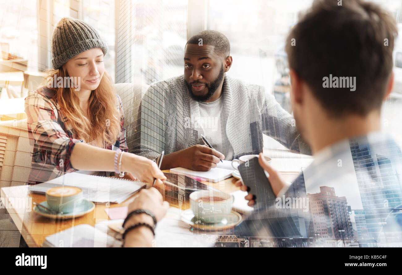 Intelligent students working with notes Stock Photo - Alamy