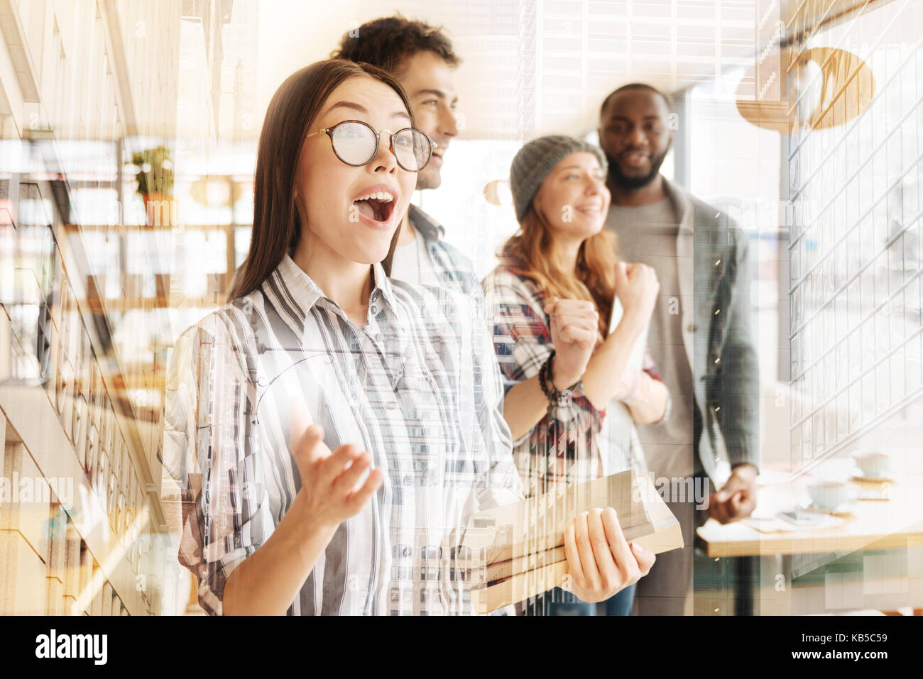 Smiling colleagues being surprised Stock Photo - Alamy