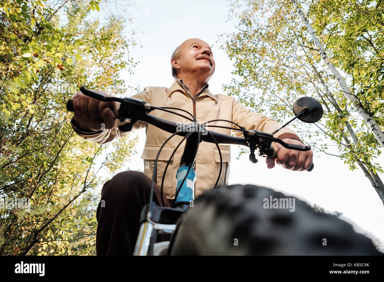 Senior man on cycle ride in countryside Stock Photo - Alamy