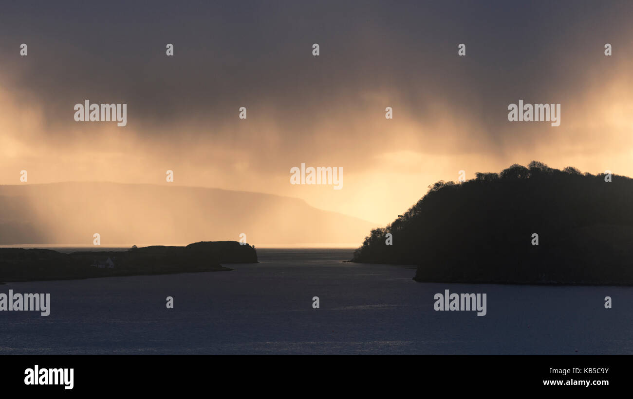 Snow Squalls passing across of the Sound of Mull at sunset, Tobermory ...