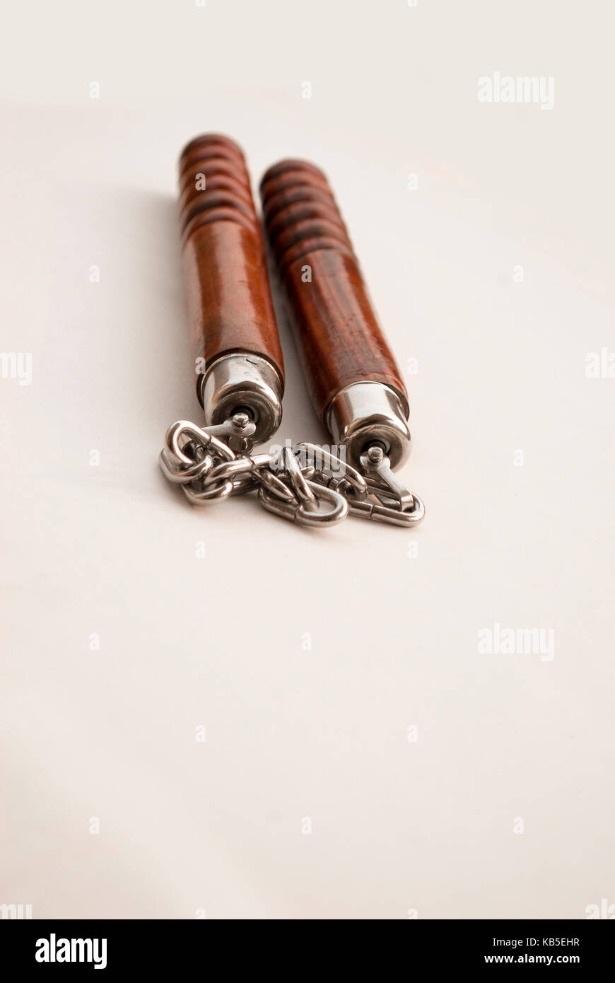 Martial arts nunchaku weapon Stock Photo - Alamy