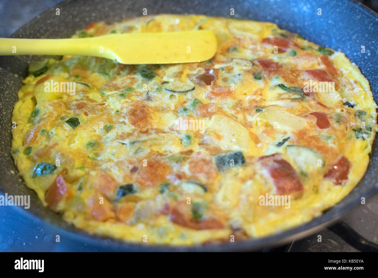cheese omelette with colorful vegetables in pan Stock Photo - Alamy