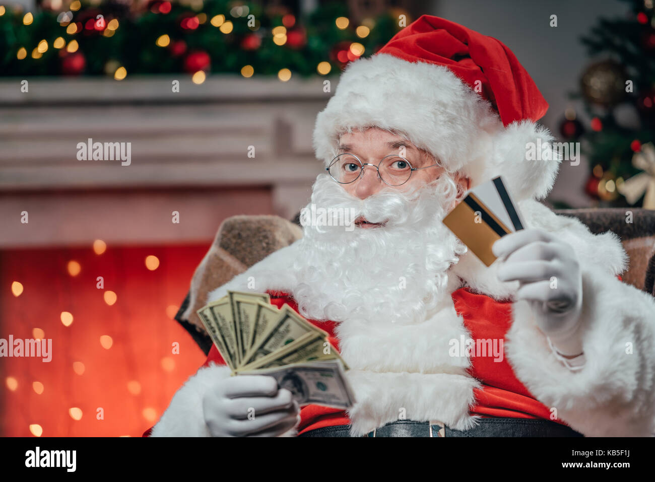santa with credit cards and dollars Stock Photo - Alamy