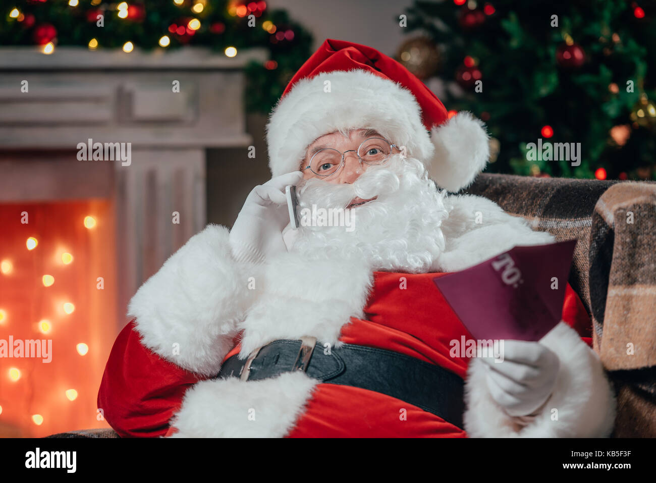 santa talking on smartphone Stock Photo - Alamy