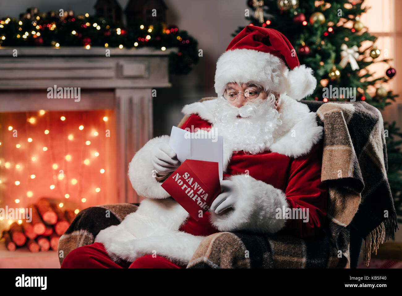 santa claus reading letter Stock Photo - Alamy
