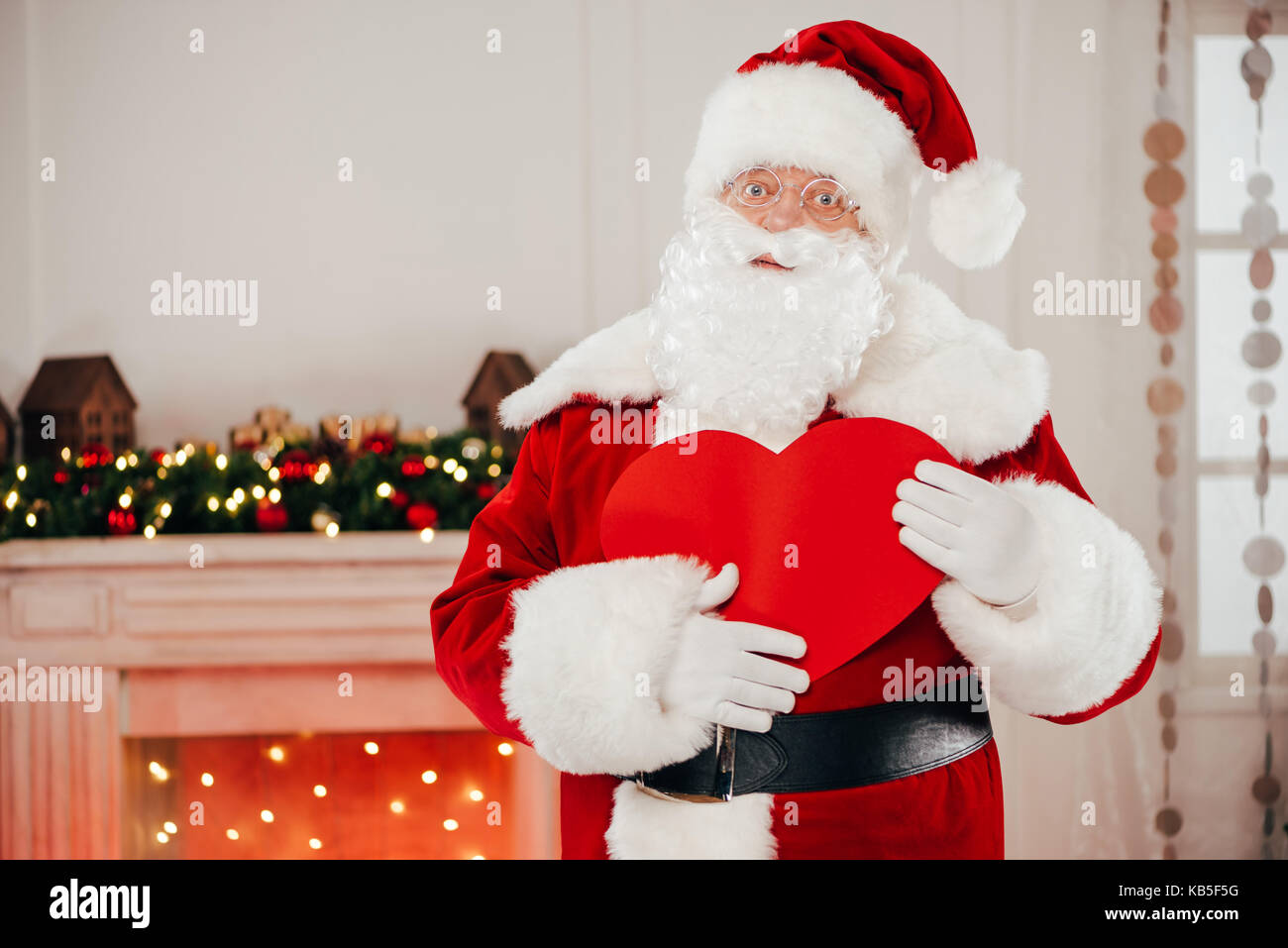 santa with heart sign Stock Photo - Alamy