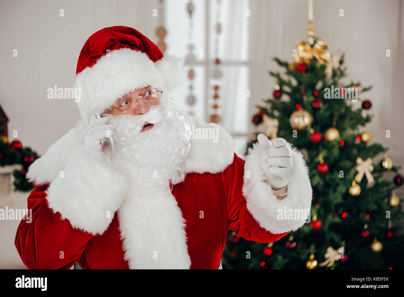 santa using smartphone Stock Photo - Alamy