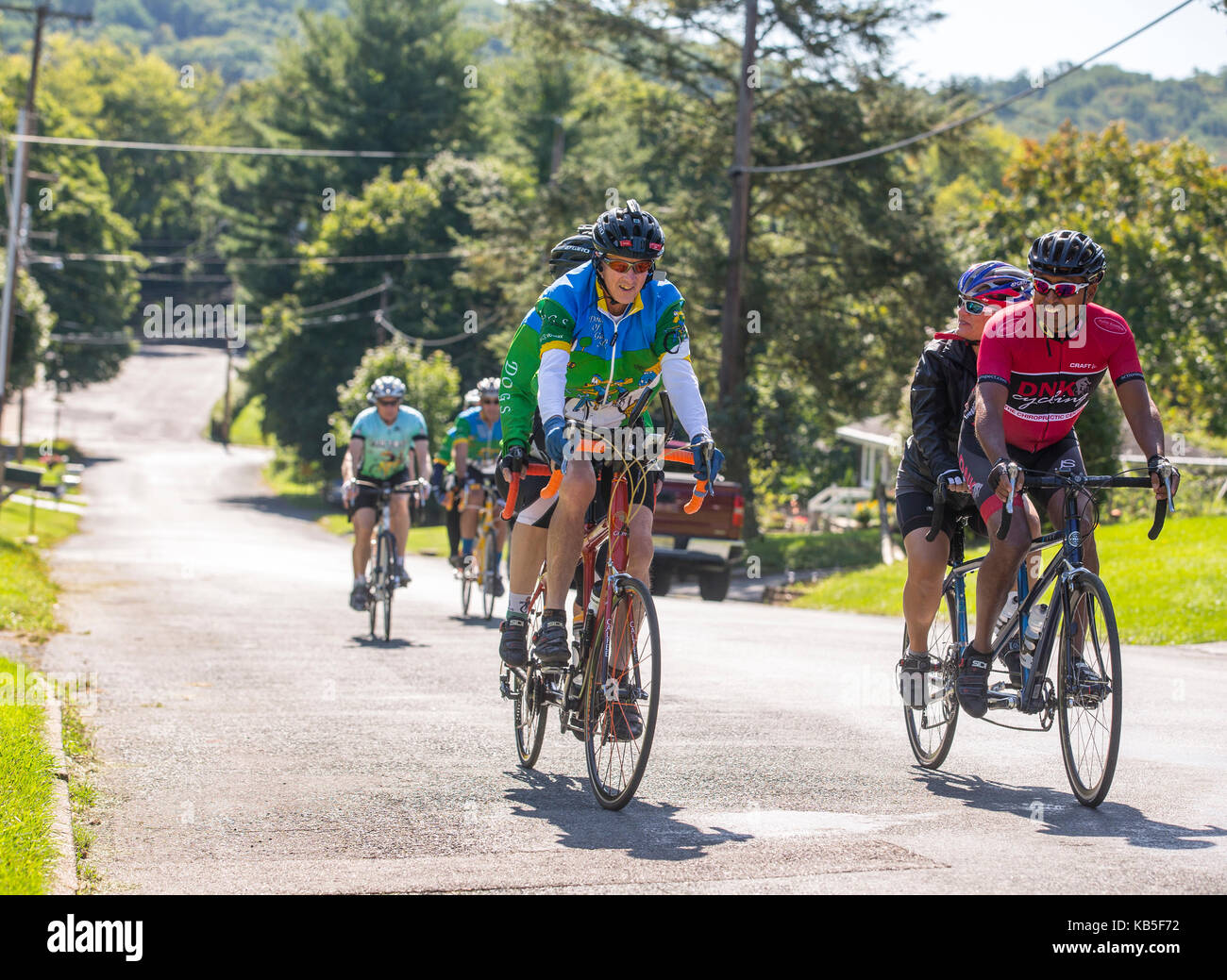 Tandem cyclists riding their bicycles Stock Photo - Alamy