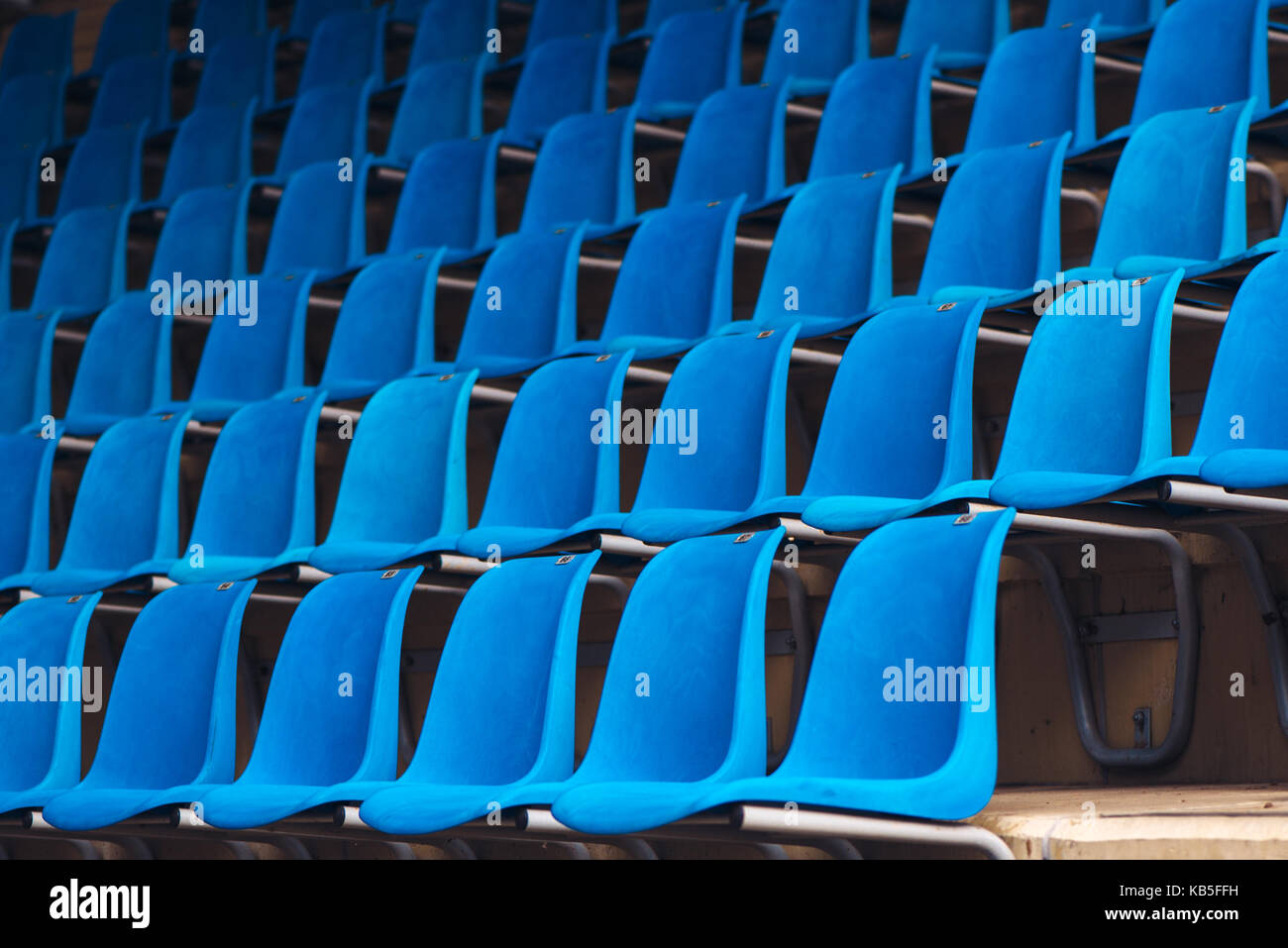 Blue plastic stadium seats as repeating pattern Stock Photo - Alamy