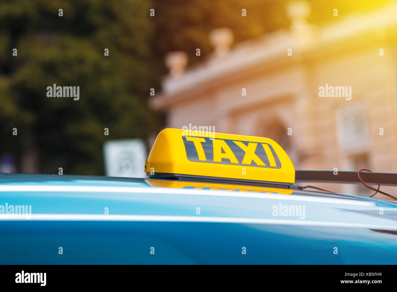 Yellow taxi sign on cab vehicle roof, selective focus Stock Photo - Alamy