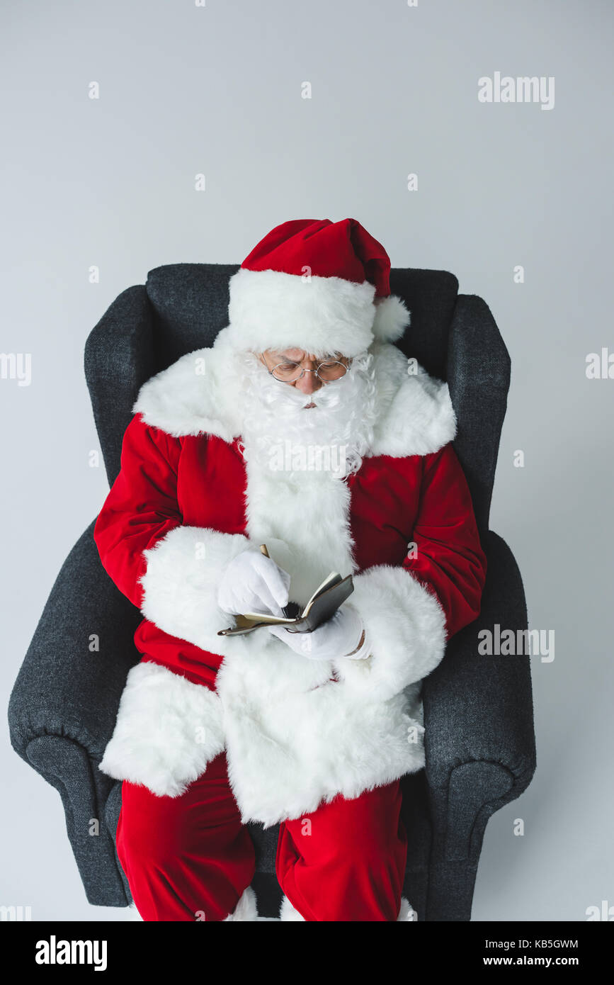 santa claus writing in notebook Stock Photo - Alamy