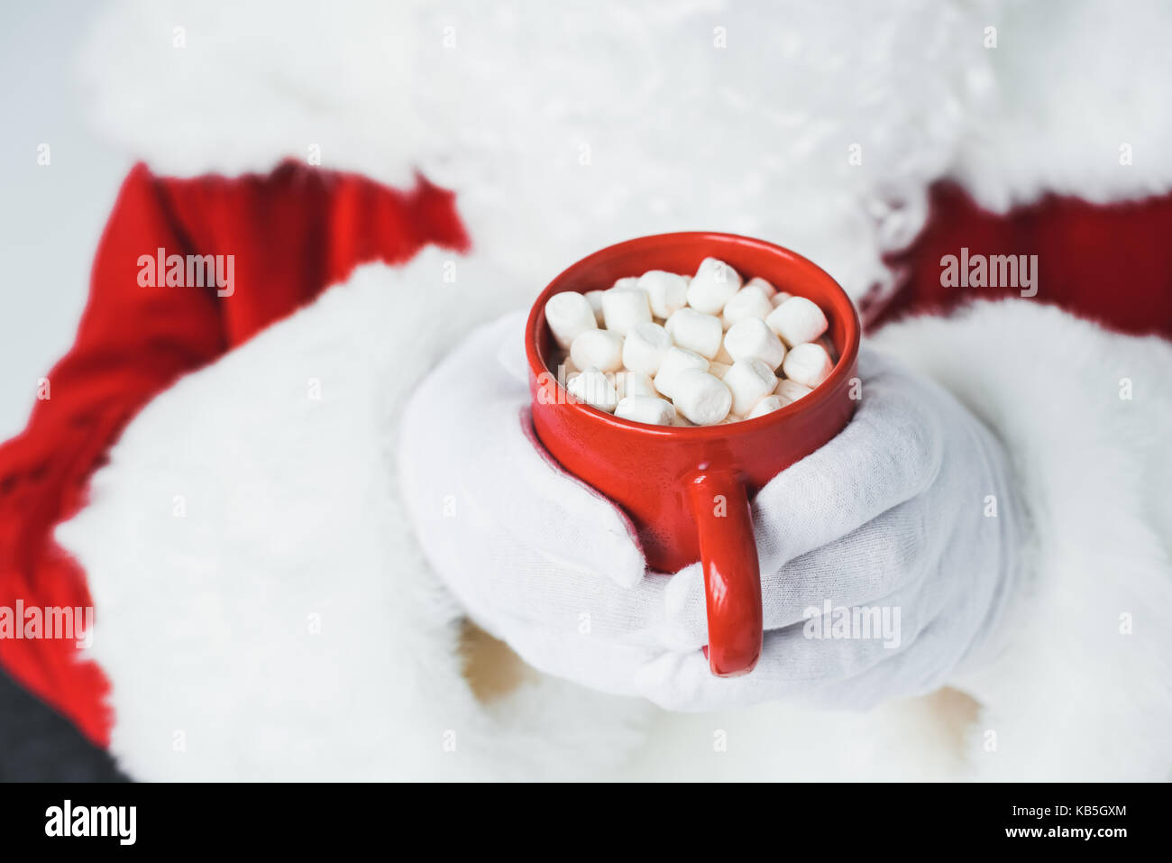 santa drinking hot chocolate with marshmallows Stock Photo - Alamy