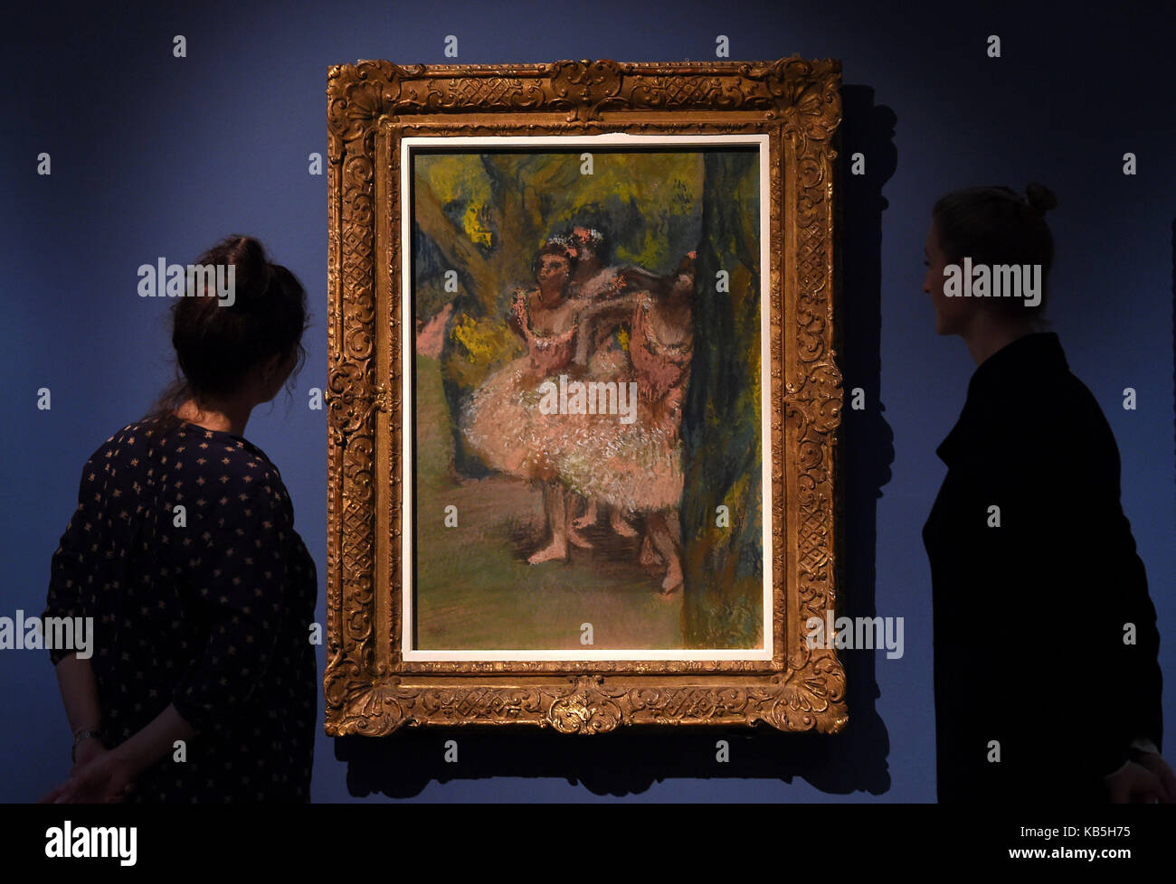 People view "Dancers in the wings" by Edgar Degas which is on display ...