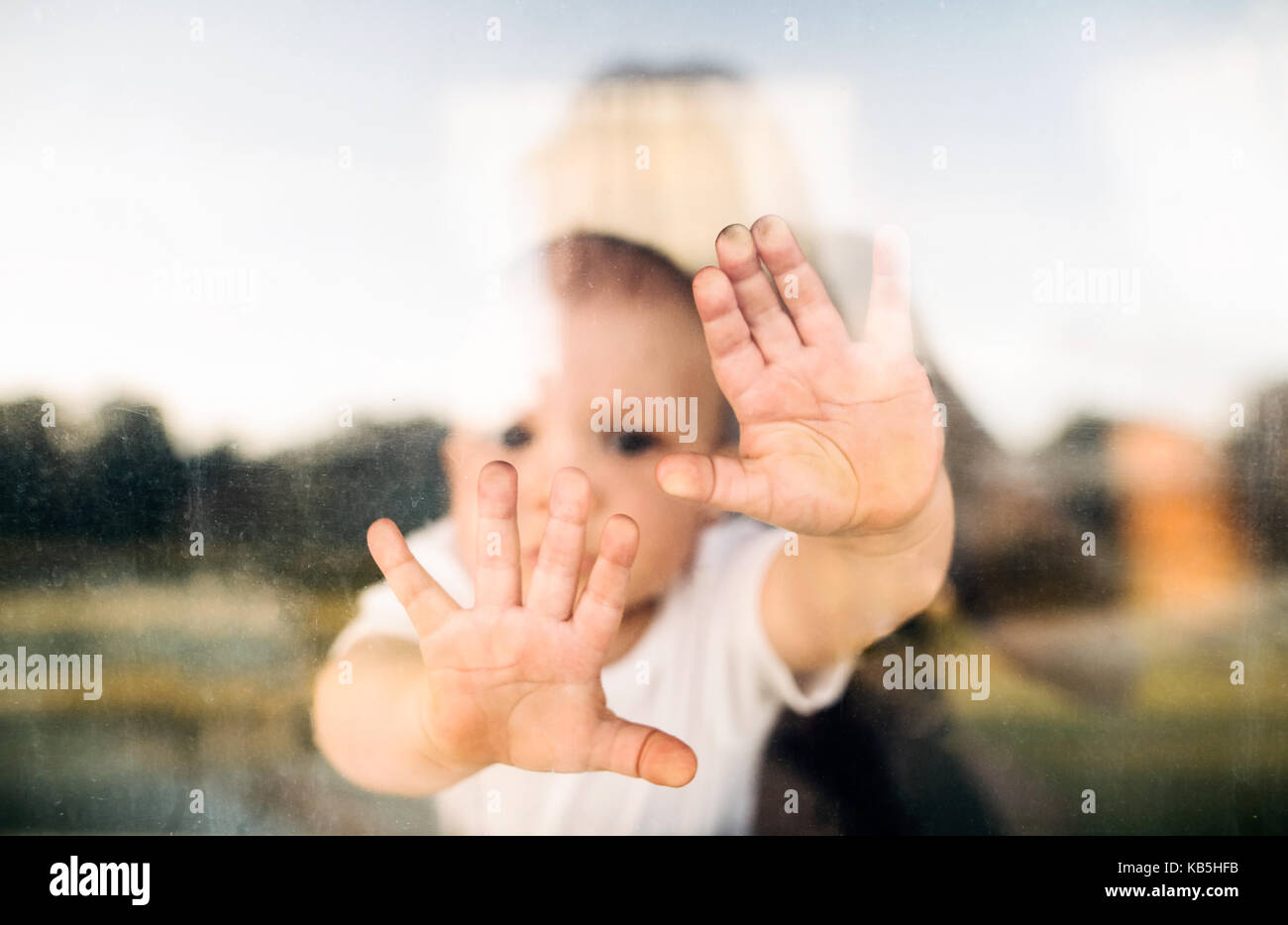 Baby boy at the window Stock Photo - Alamy