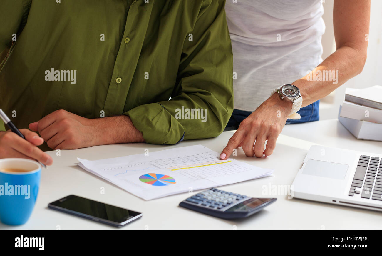 Man working with an analysis report in an office background Stock Photo ...