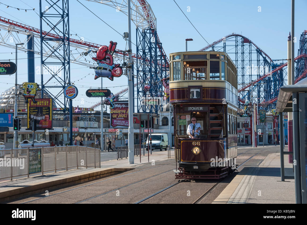 Traditional tram passing the Pleasure Beach, Blackpool, Lancashire ...